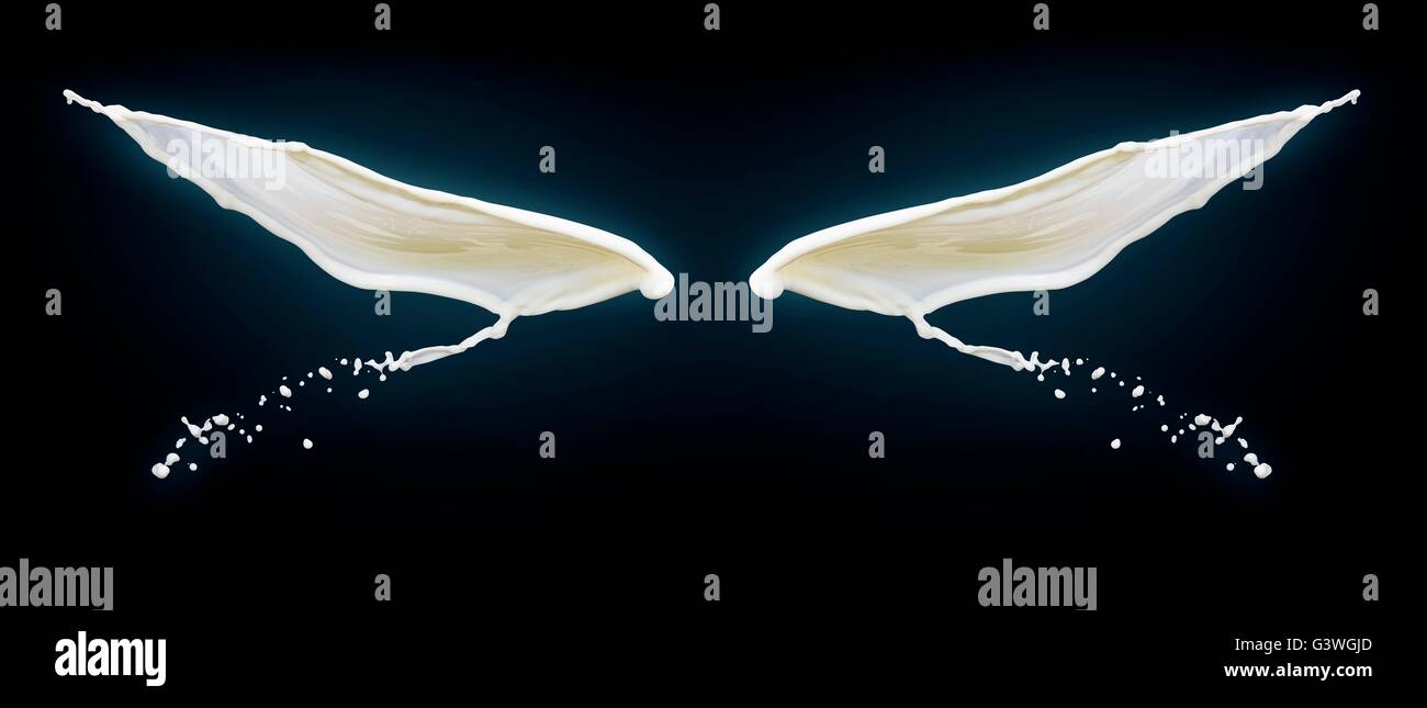 Wings on black background made of splashes of milk Stock Photo - Alamy