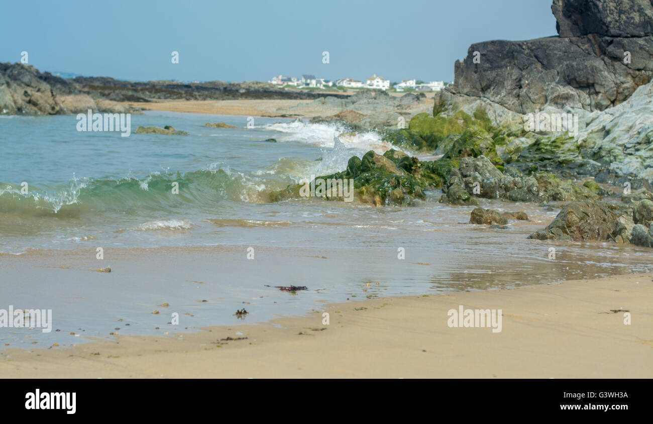 Delicate waves at Porth Nobla, Rhosneigr, Anglesey Stock Photo - Alamy