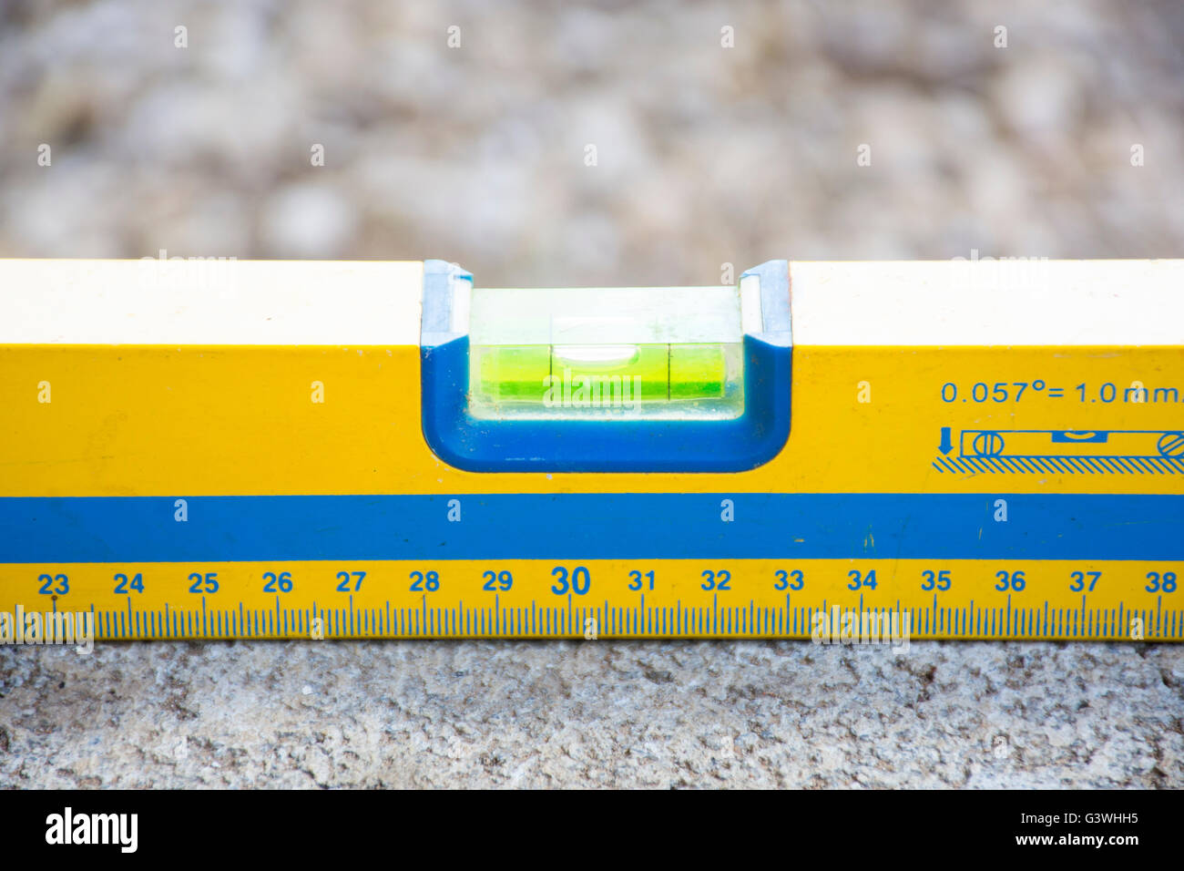 Used level tool on brick with background rock nature.Background ...