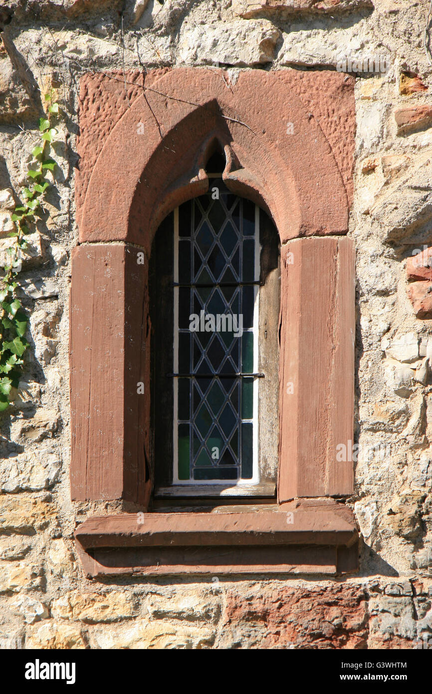 A window on the facade of a medieval private house in Saint-Cirq ...