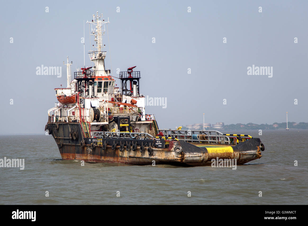 MUMBAI, INDIA - OCTOBER 11, 2015: Industrial ship in the waters of ...
