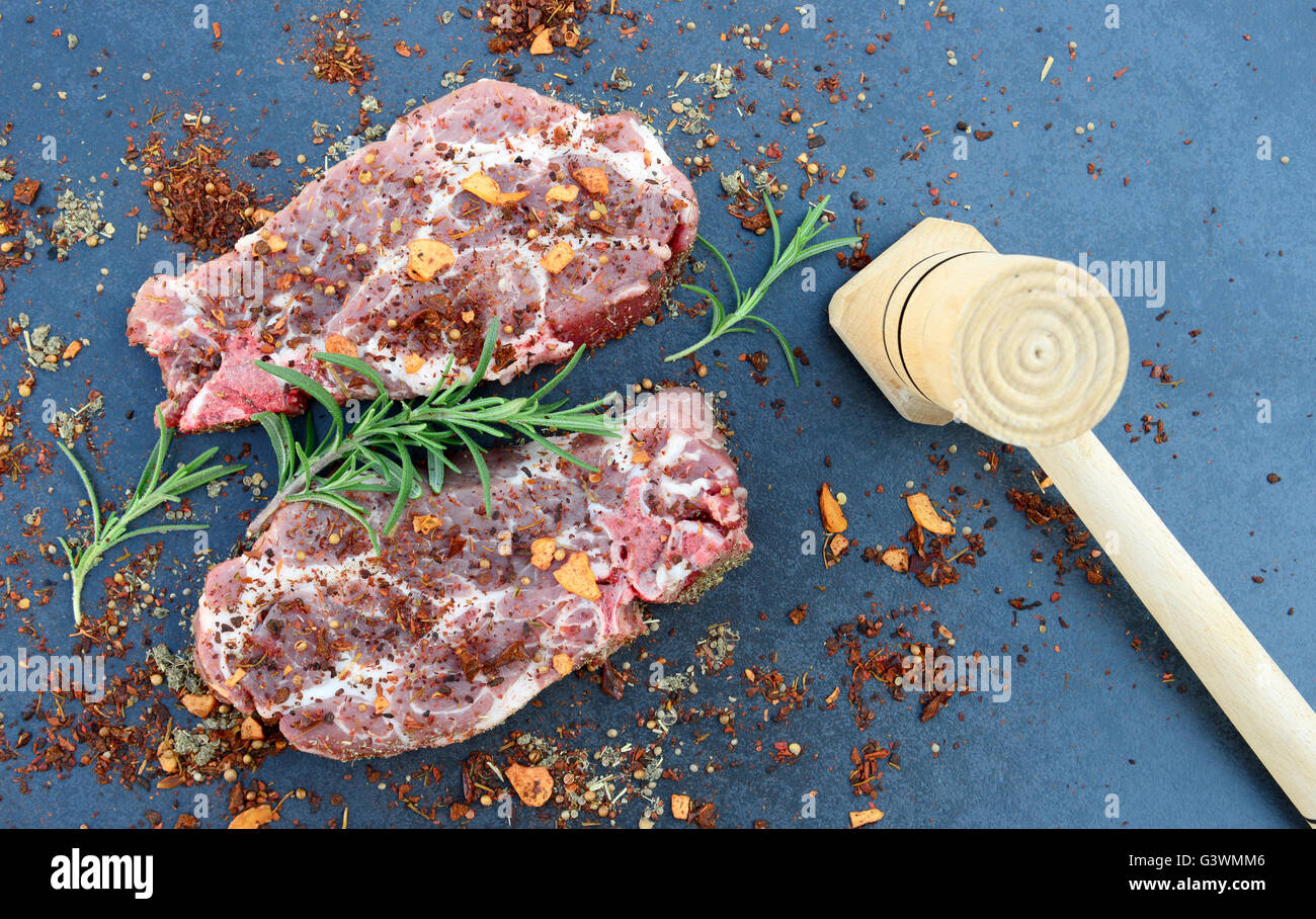 Raw meat on the table top in natural stone Stock Photo - Alamy