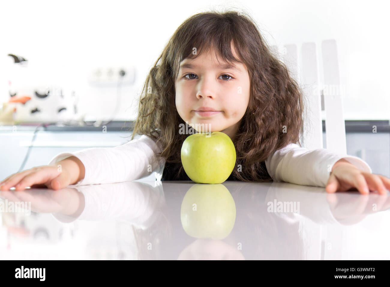 Girl with green apple Stock Photo - Alamy