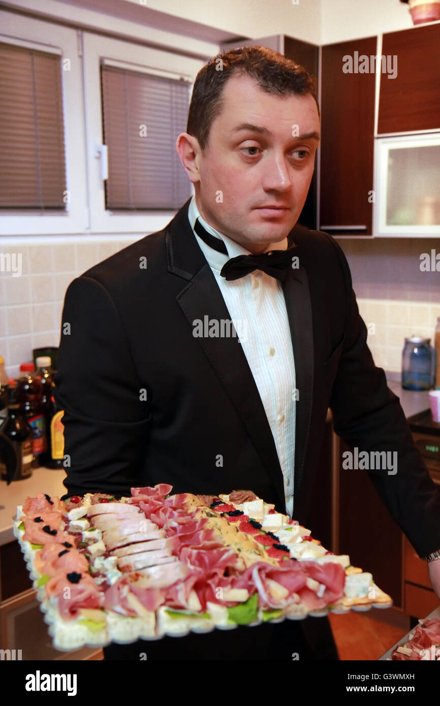 Waiter serving meat dish wedding hi-res stock photography and images ...