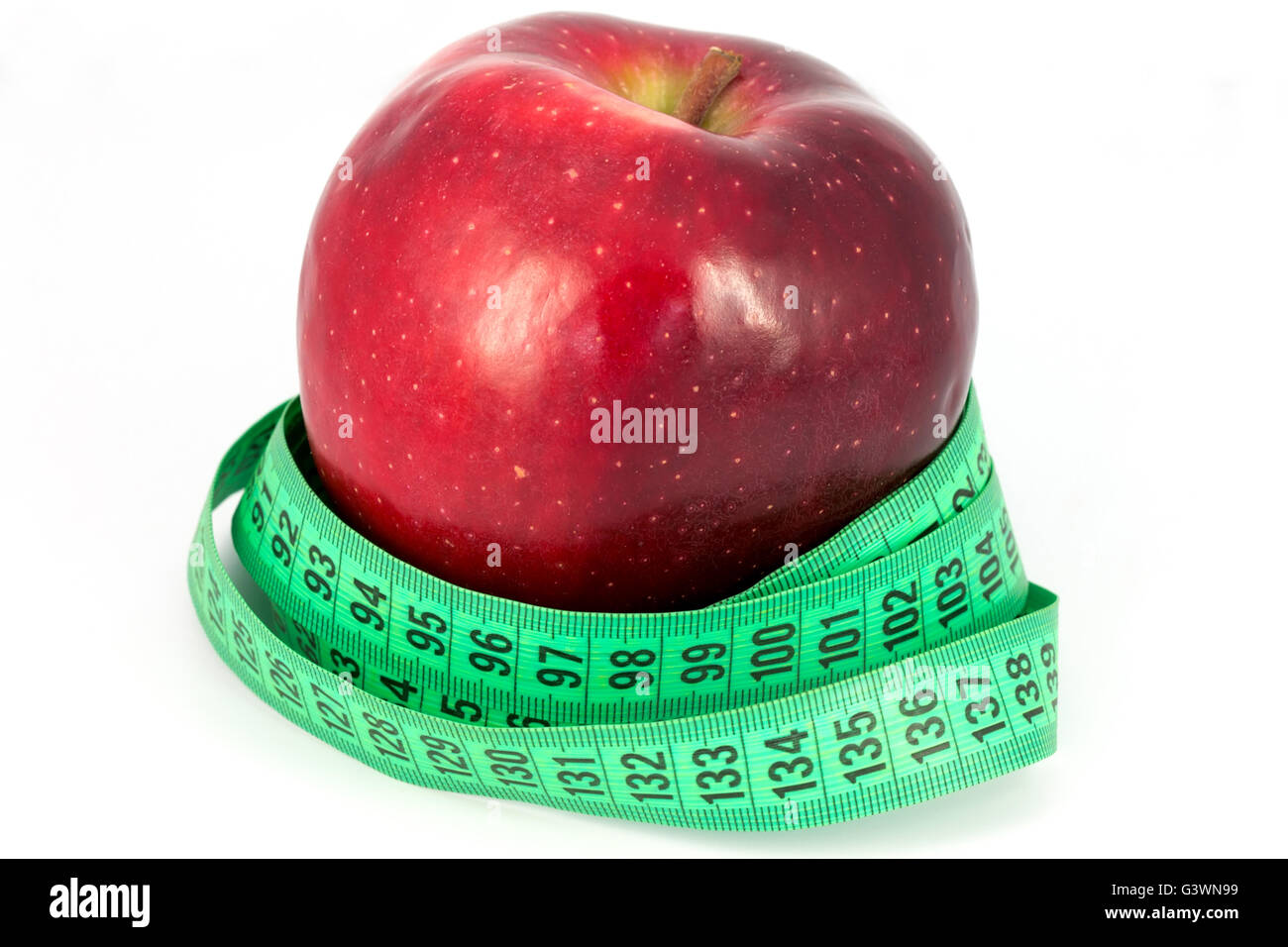 Apple with a tape measure Stock Photo - Alamy