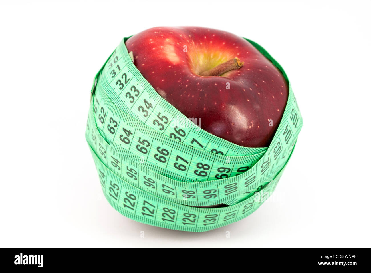 Apple with a tape measure Stock Photo - Alamy