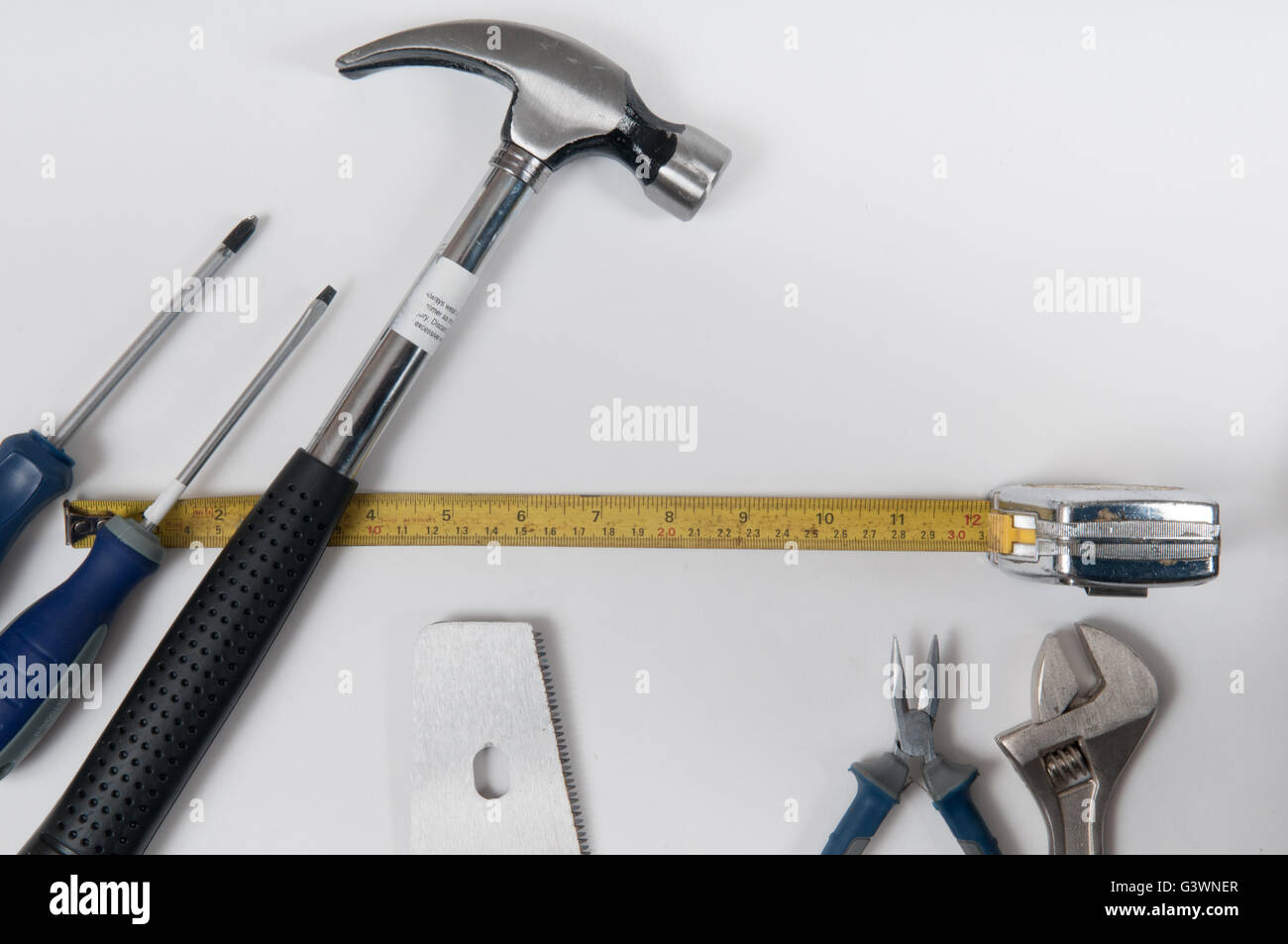 variety of tools for diy or home improvement arranged on a white ...