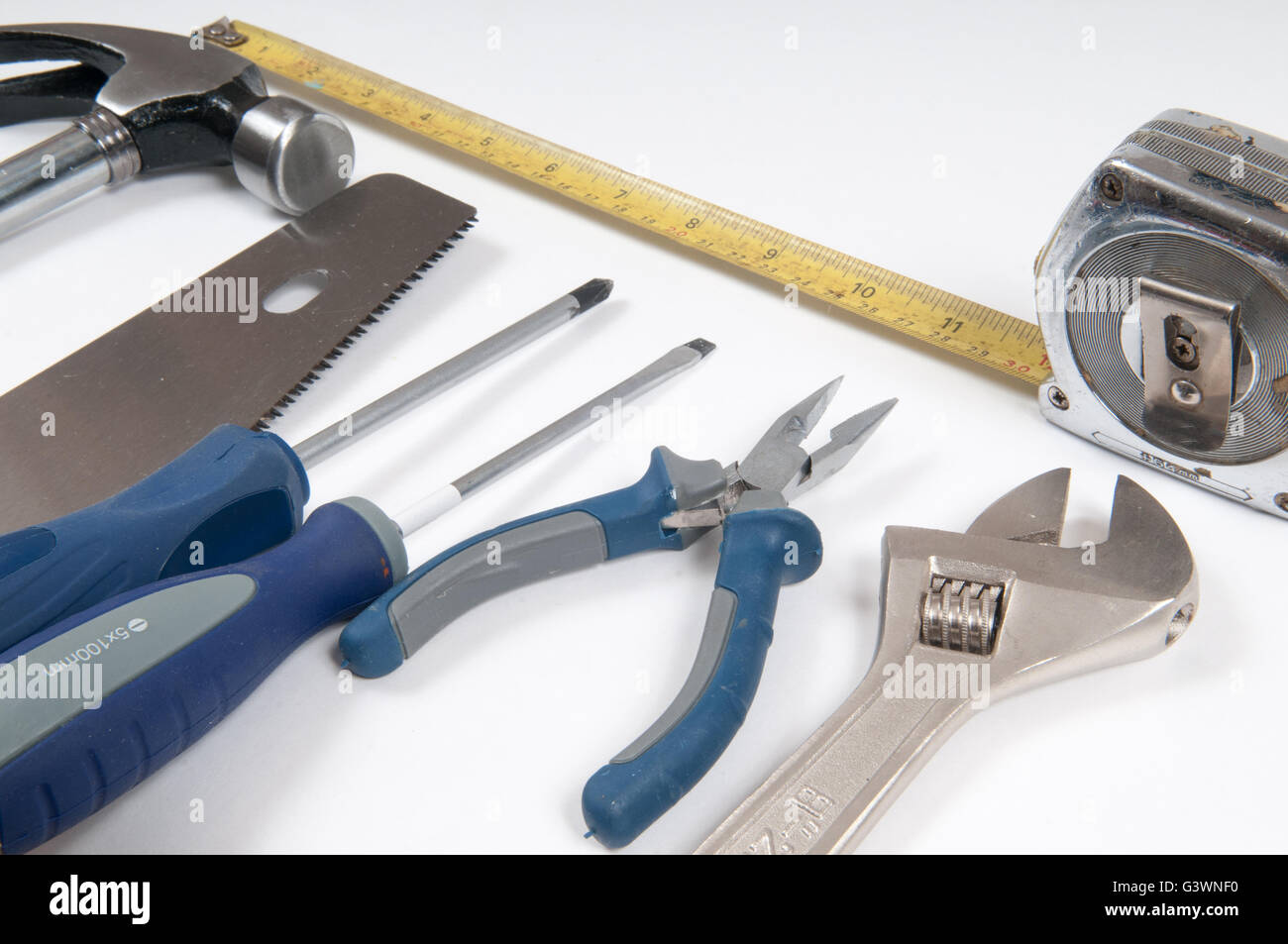 variety of tools for diy or home improvement arranged on a white ...