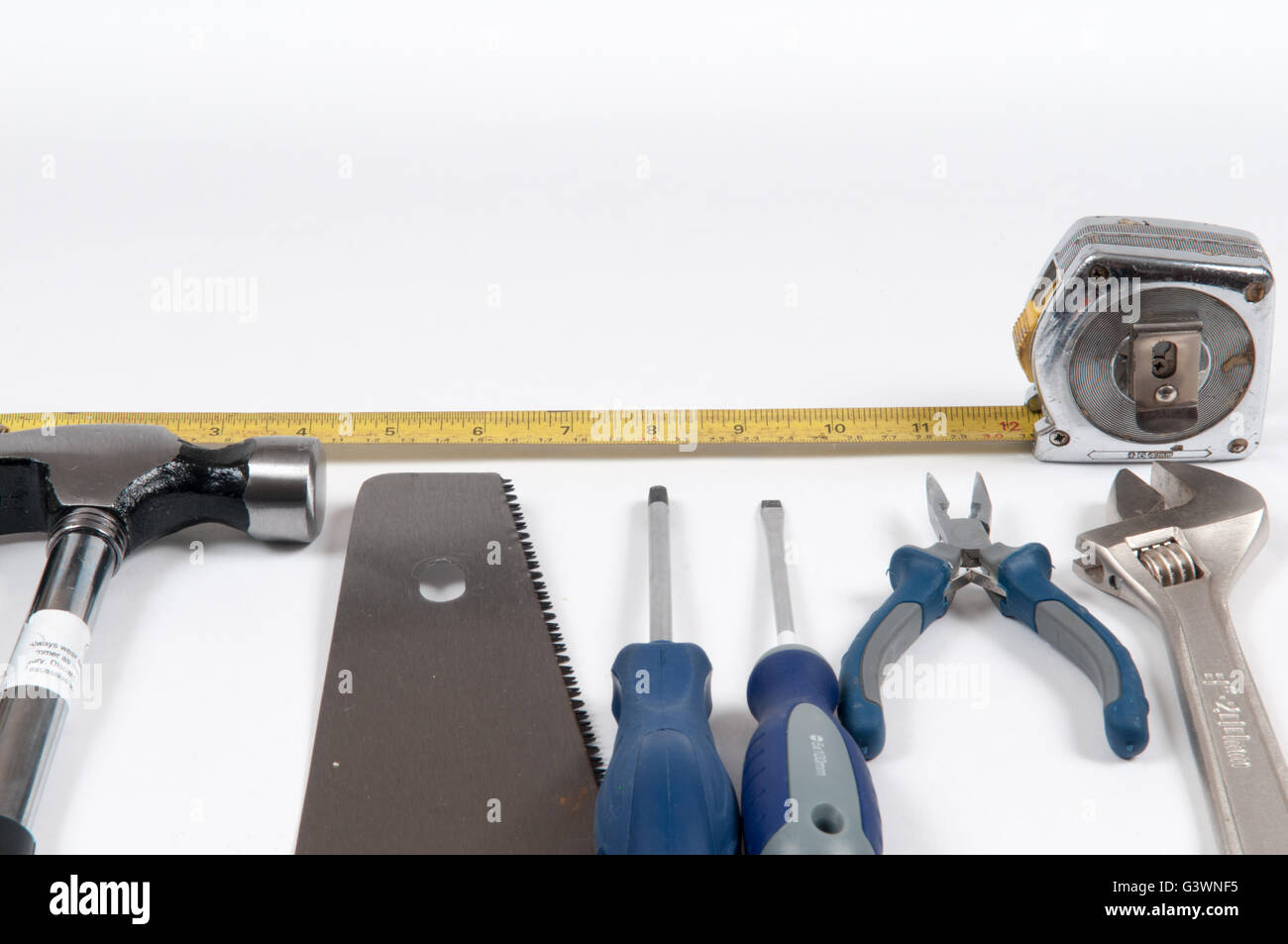variety of tools for diy or home improvement arranged on a white ...