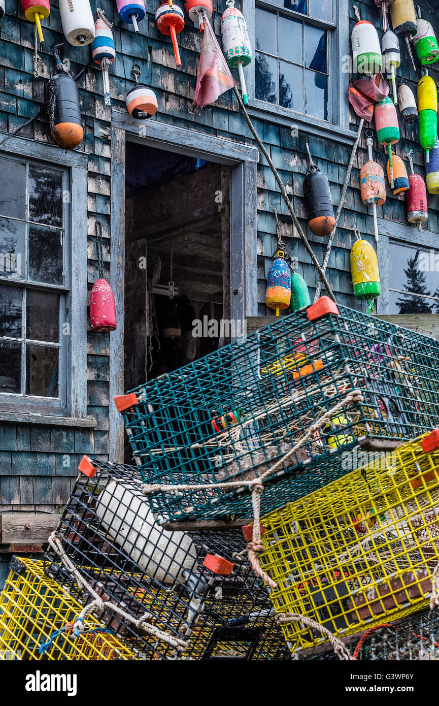 Colorful buoys adorn a rustic coastal shack, Bernard, Mt Desert Island ...