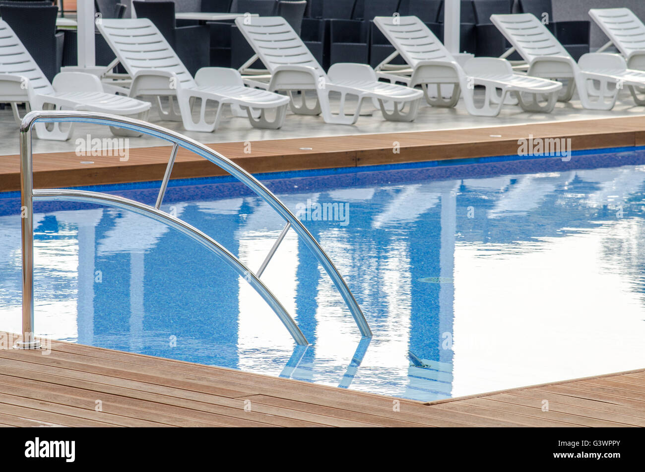 clean swimming pool and empty resting chair Stock Photo - Alamy