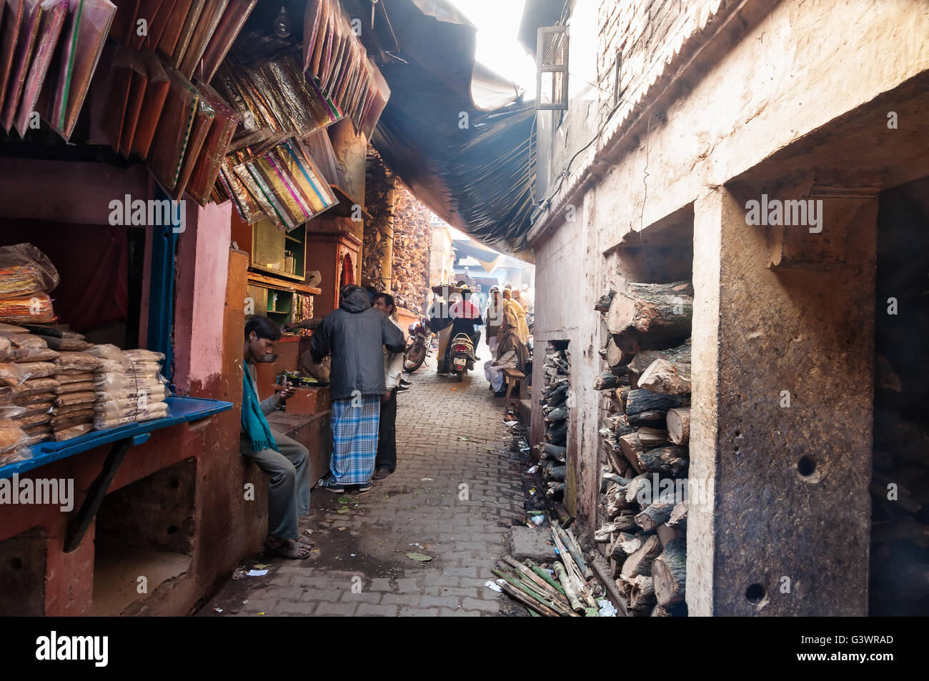 On the narrow street in the old city of Varanasi. Uttar Pradesh, India ...