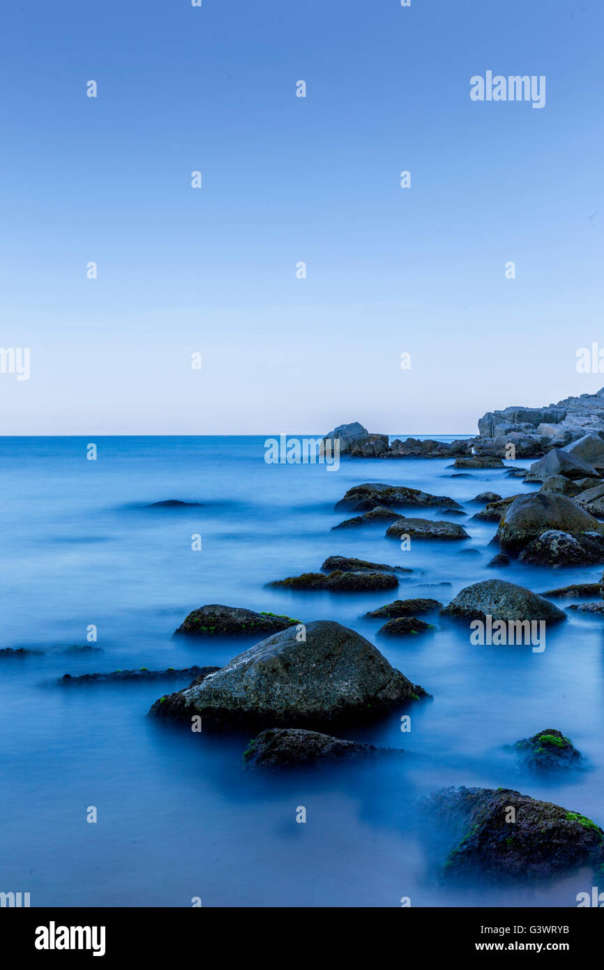 Rocks in the calm sea at the Costa Brava in Spain Stock Photo - Alamy