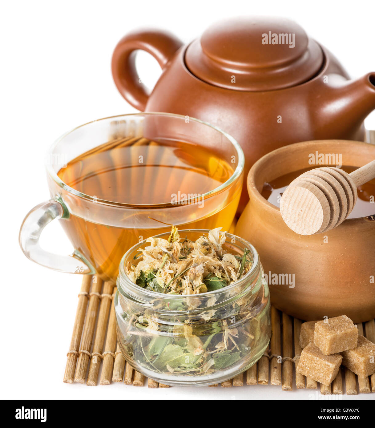 Eco Natural herbal tea in a transparent glass cup, dried herbs, teapot ...