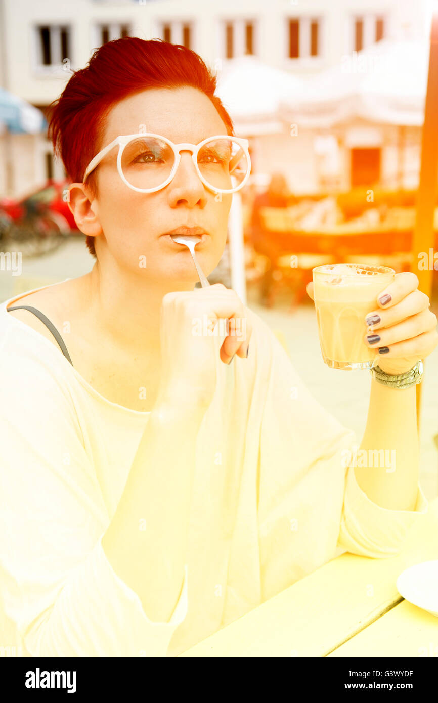Woman sitting table red coffee hi-res stock photography and images - Alamy