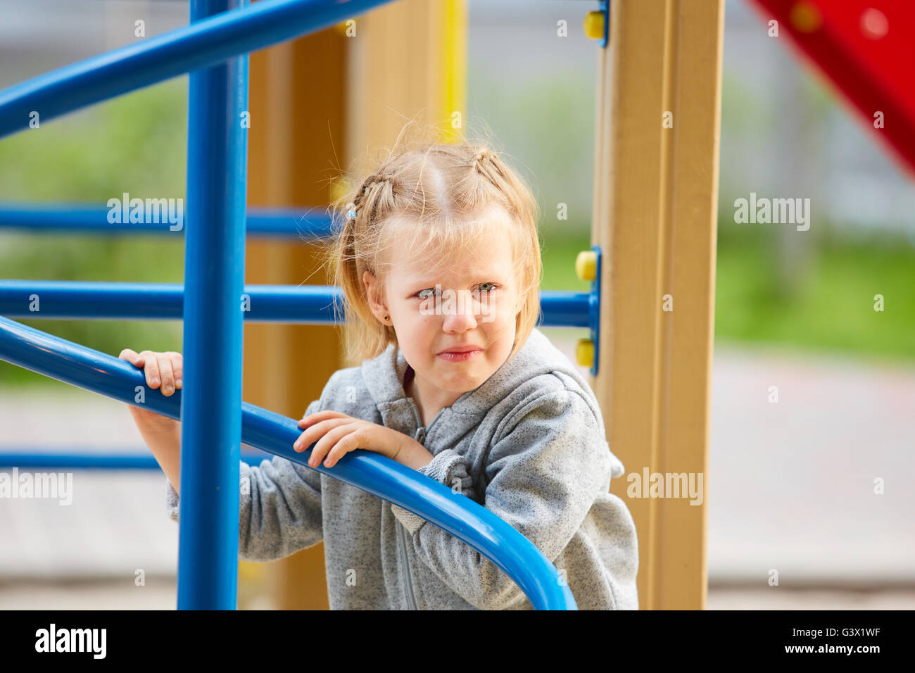 Beautiful sad little girl crying, on summer background Stock Photo - Alamy
