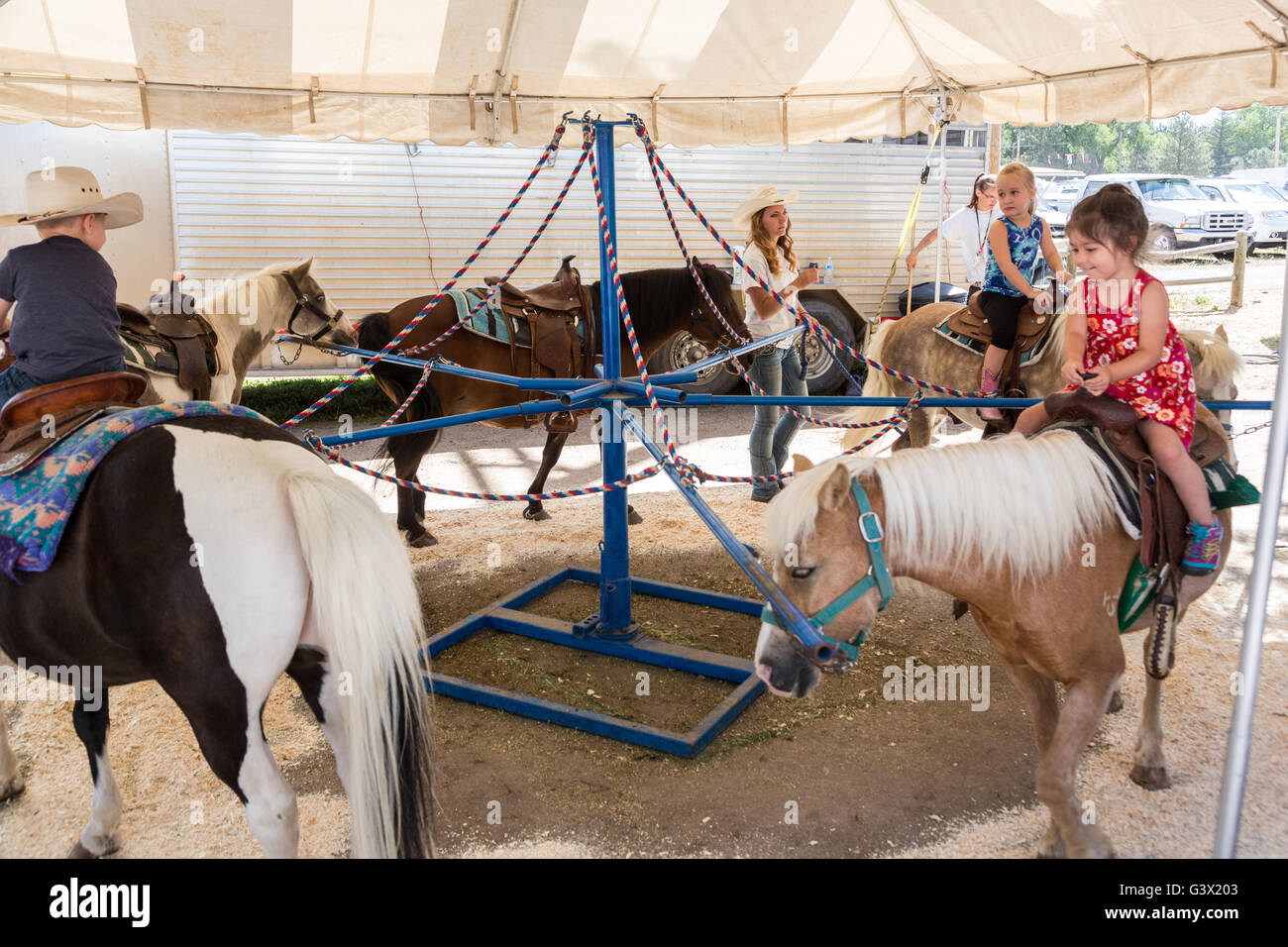 Kids pony ride cowboys hi-res stock photography and images - Alamy