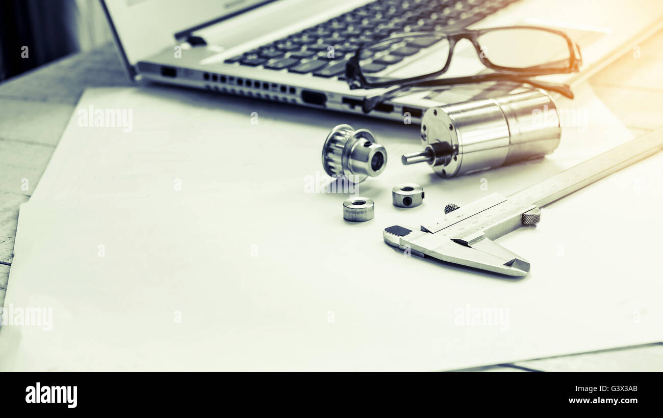 closeup of vernier caliper and engineering accessories on drawing sheet ...