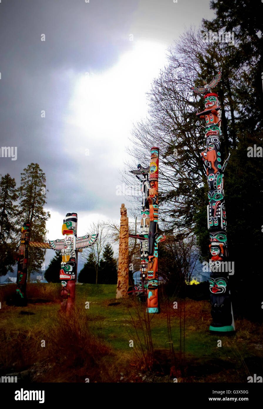 Colorful Totem poles in Vancouver Stock Photo - Alamy