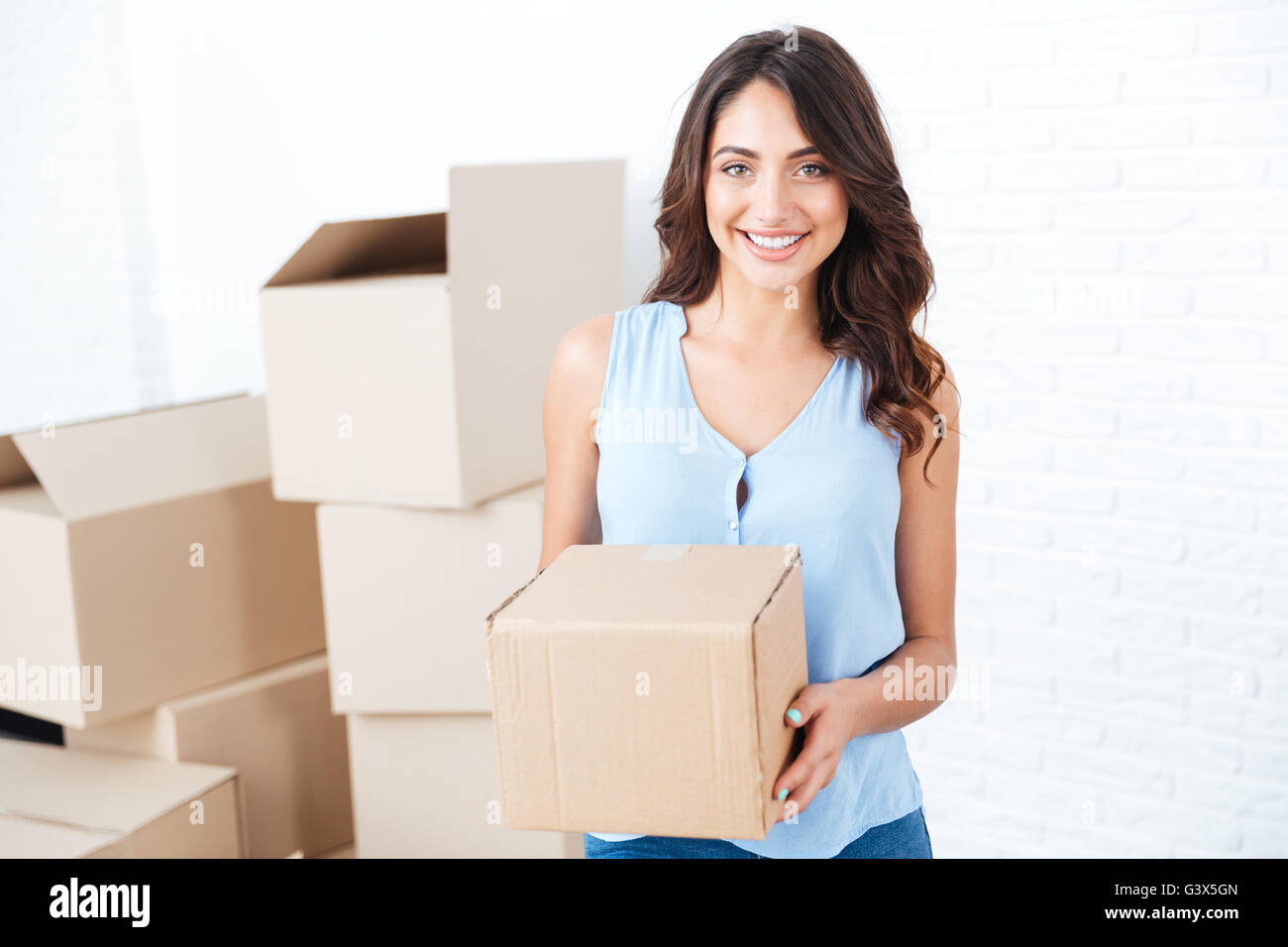 Girl moving furniture hi-res stock photography and images - Alamy