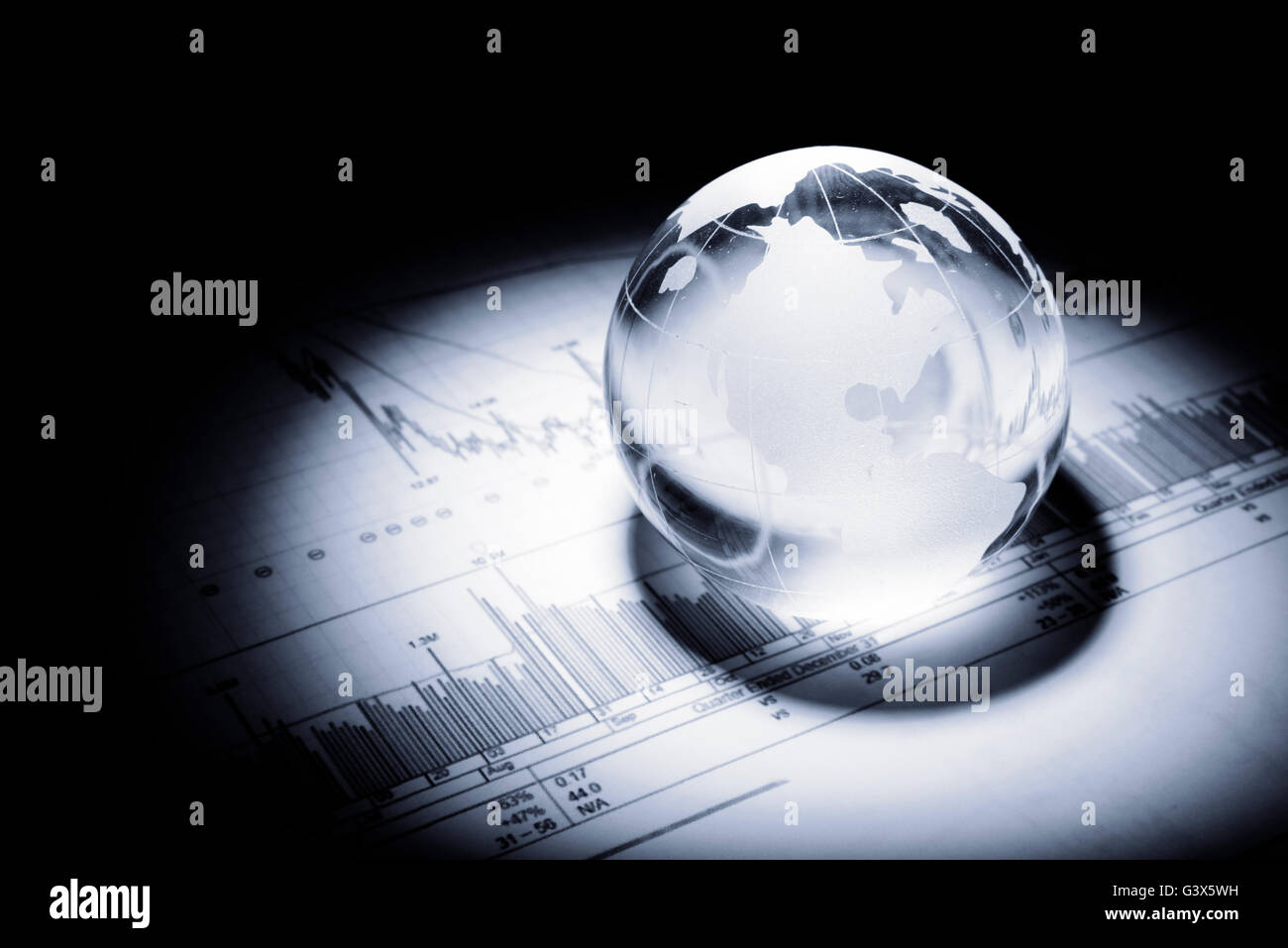 business concept of a glass globe on a trading chart Stock Photo - Alamy