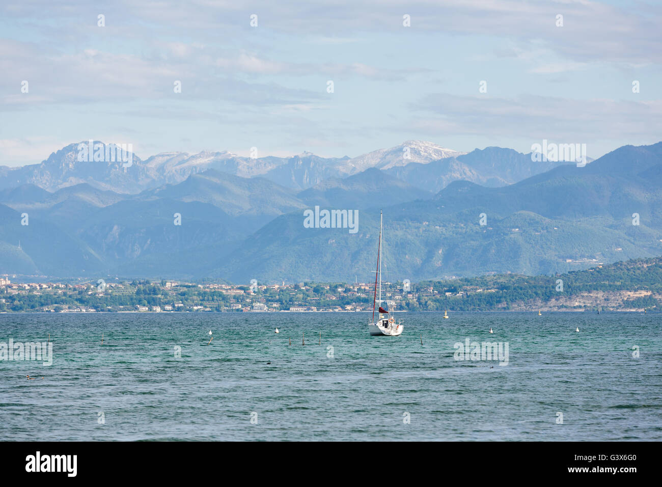 Lonely yacht on the Lake Garda, spring time Stock Photo - Alamy