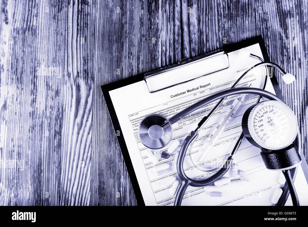 Medical concept of medical report with stethoscope and medicines on ...