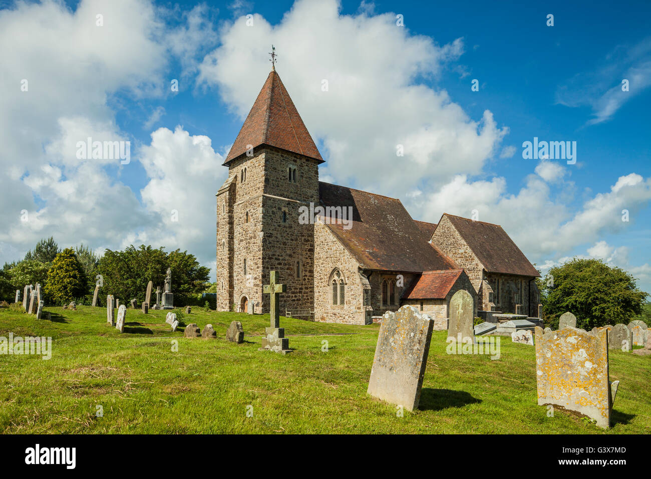 Spring afternoon at the Norman church of St Laurence in the village of ...