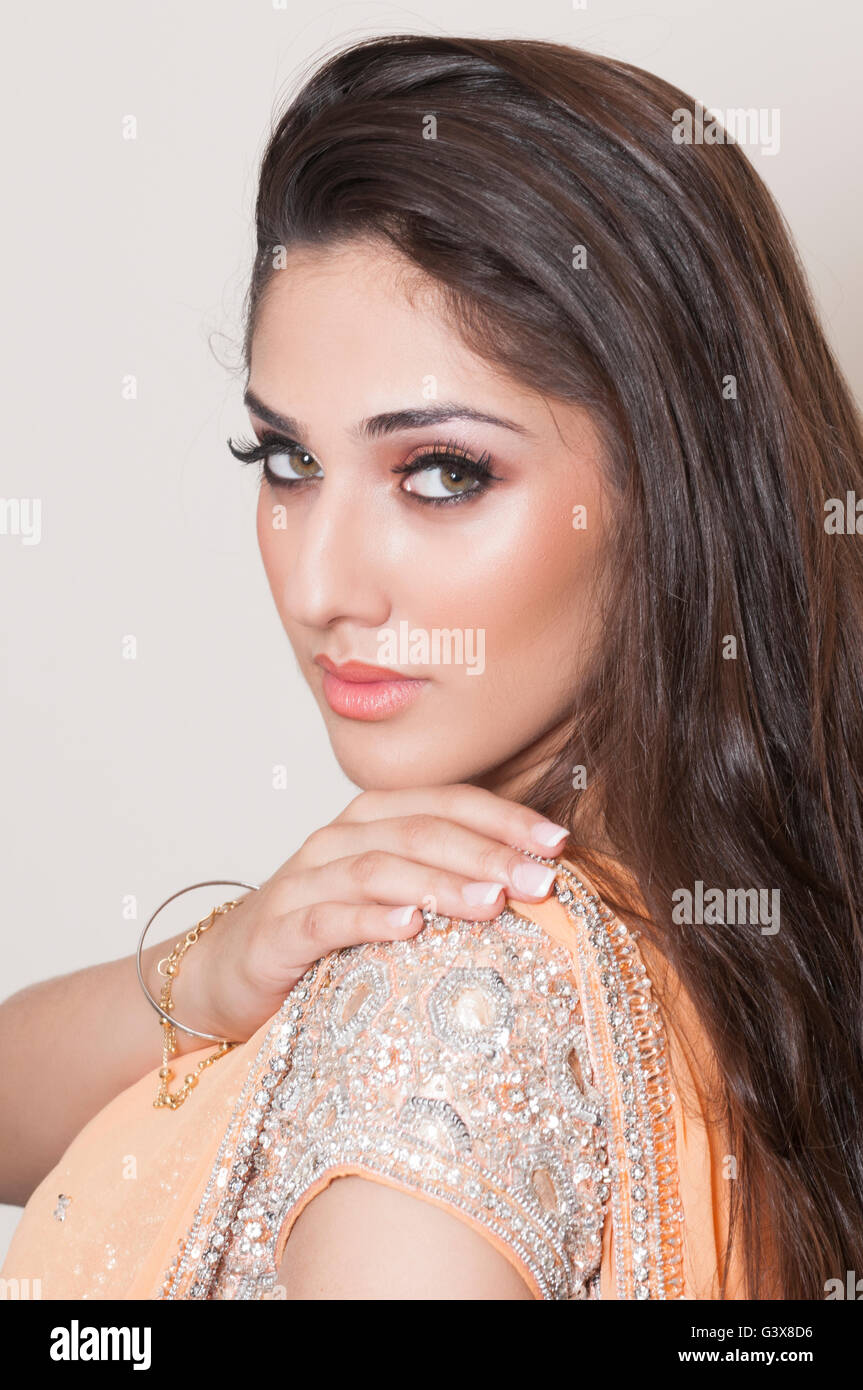 Beautiful Indian woman hand touching shoulder Stock Photo - Alamy