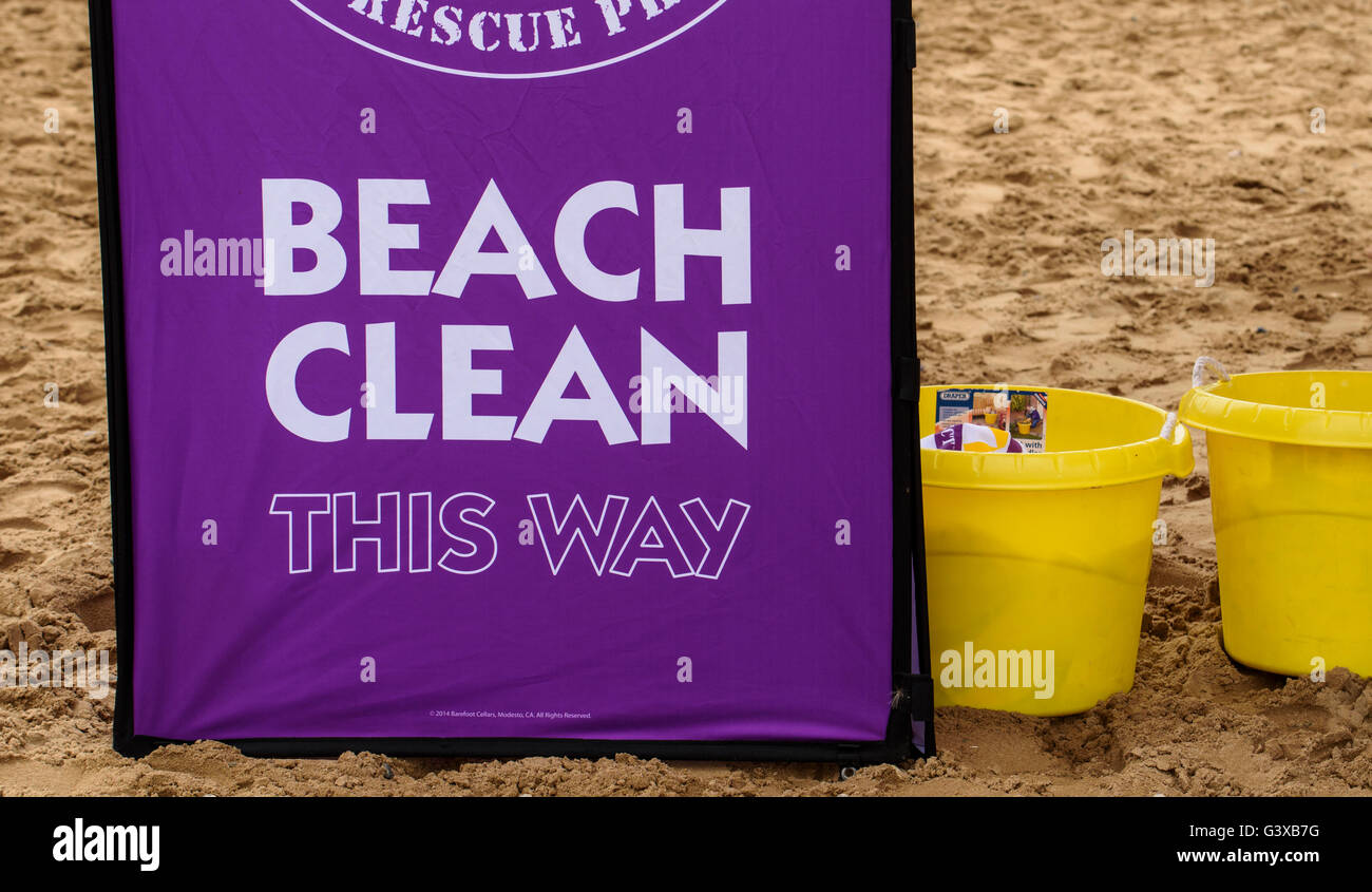 Sign stating "Beach Clean This Way" on a sandy beach in Lytham St Anne ...