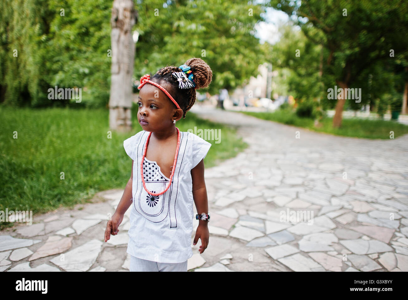 Close up portrait of african baby girl walking at park Stock Photo - Alamy