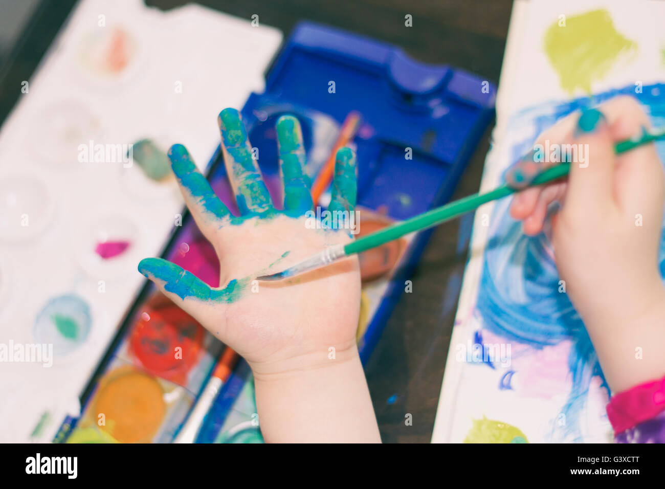 color painted child hand Stock Photo - Alamy