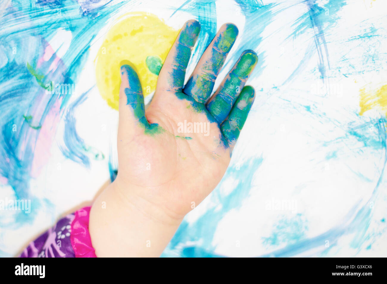 color painted child hand Stock Photo - Alamy