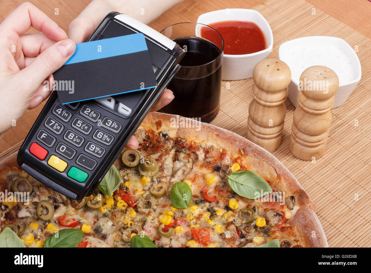 Using payment terminal with contactless credit card, cashless paying ...