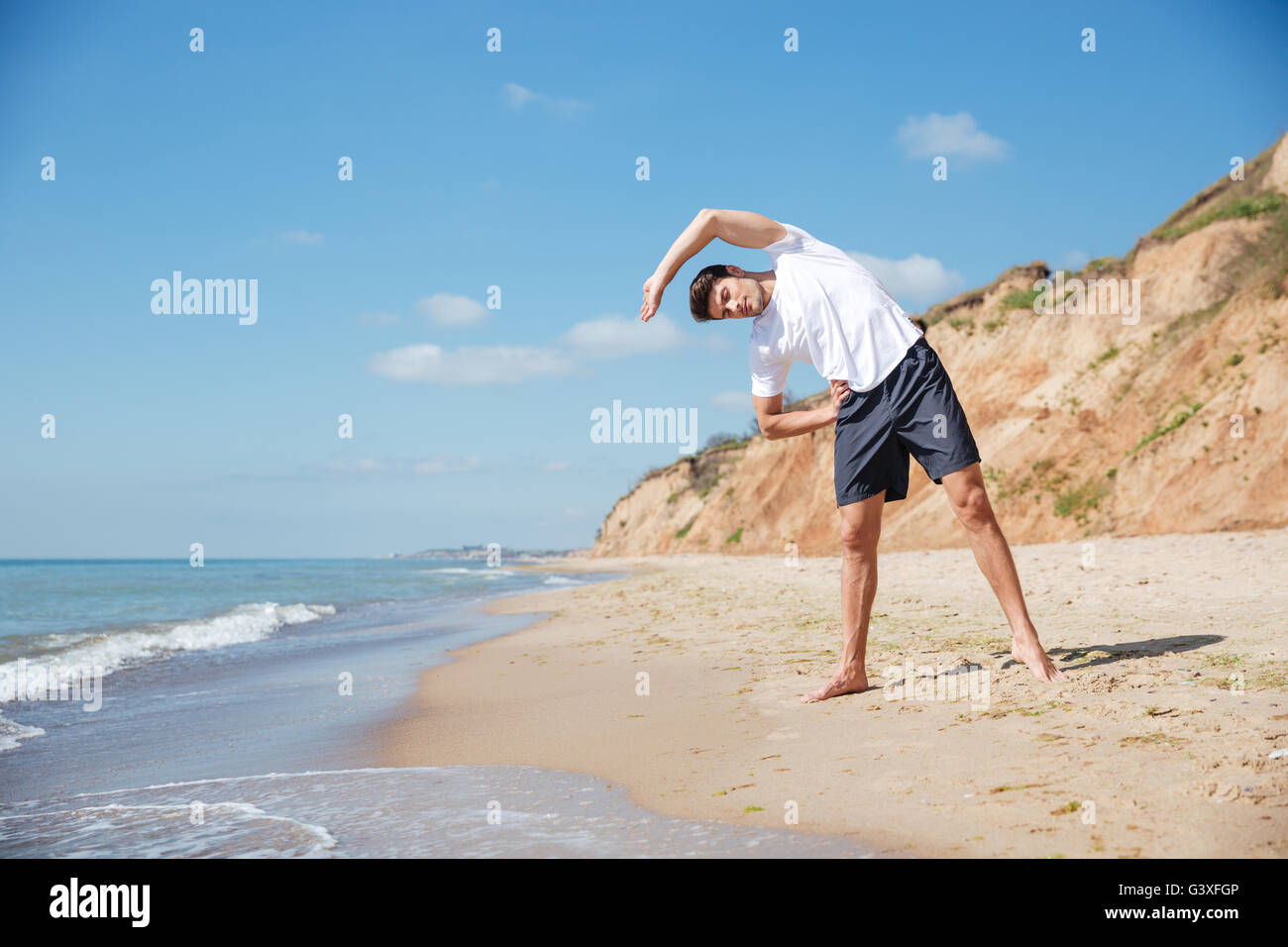 Man working on the beach hi-res stock photography and images - Alamy