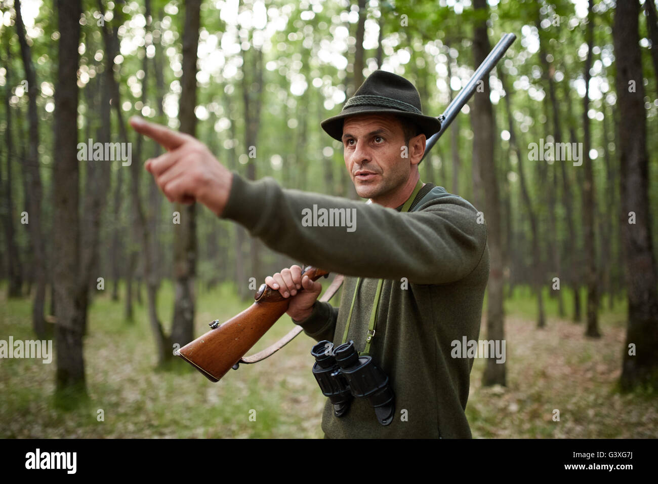 Hunter with double barrel shotgun in the forest Stock Photo - Alamy