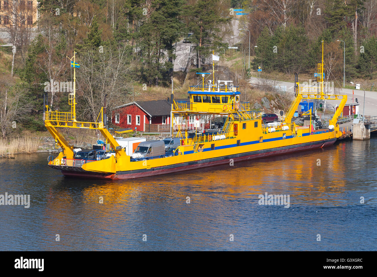Yellow Ro-Ro cargo ship loading. Small pier near Stockholm, Sweden ...