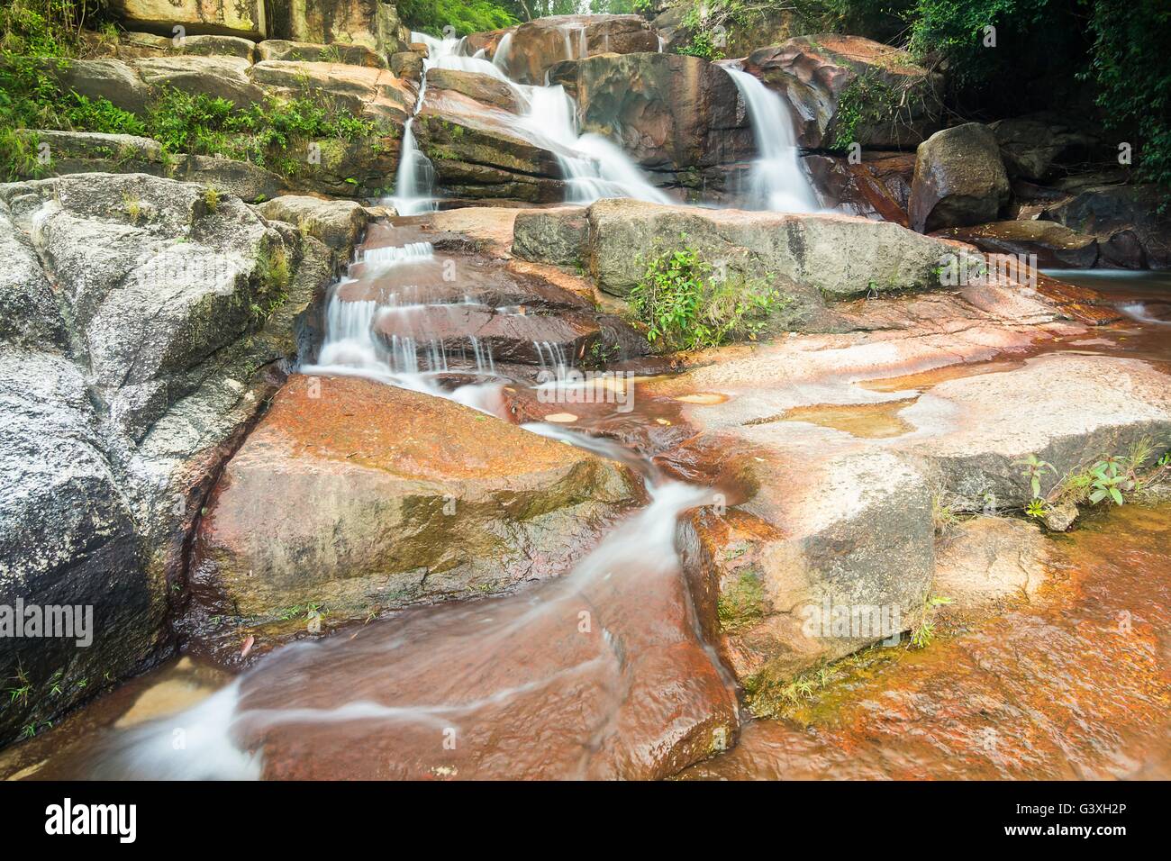 Cascading waterfall with rocks Stock Photo - Alamy