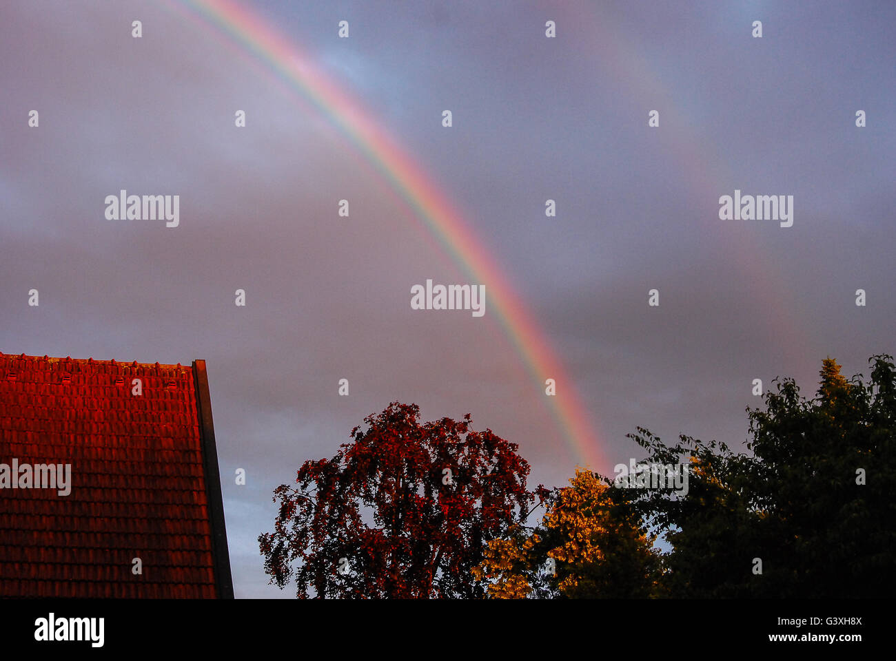 Parallel rainbows appear in the sky after a rainstorm Stock Photo - Alamy