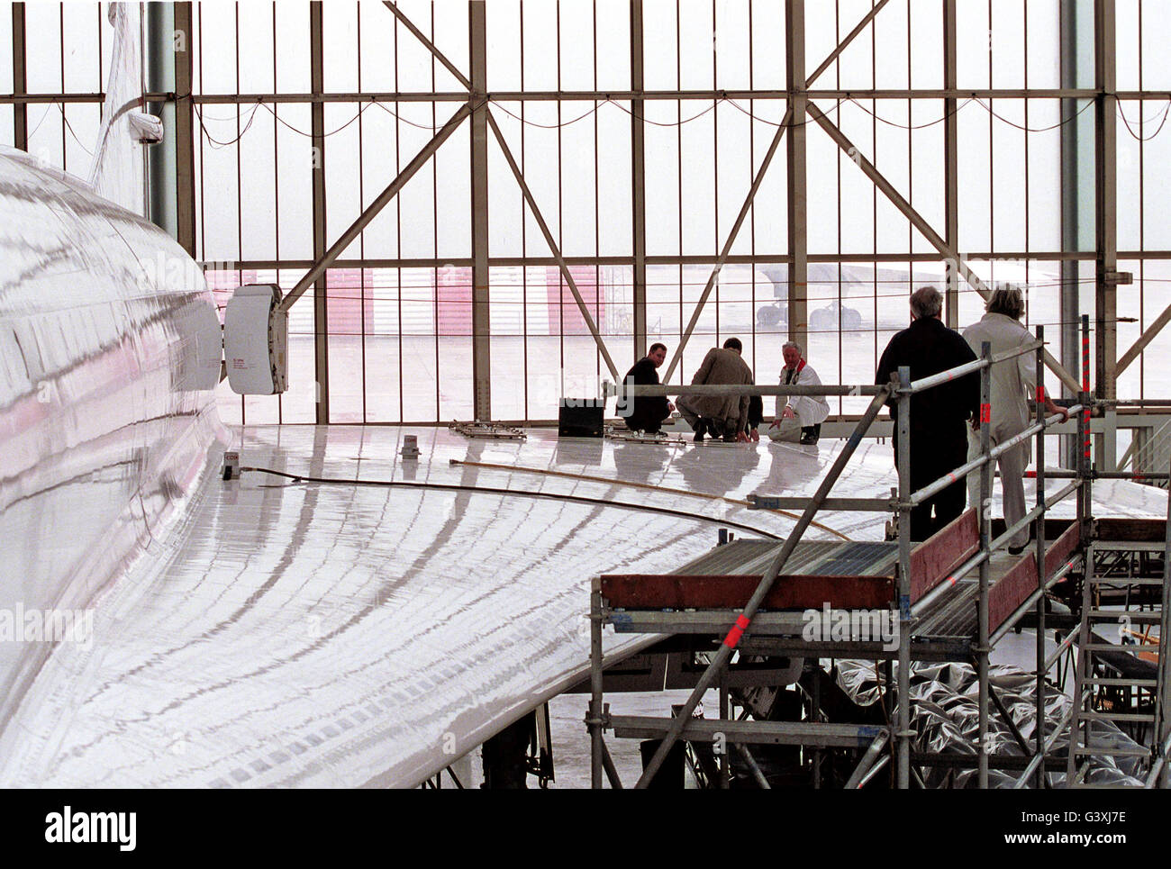 CONCORDE. Engineers on the wing of a Concorde in a British Airways ...