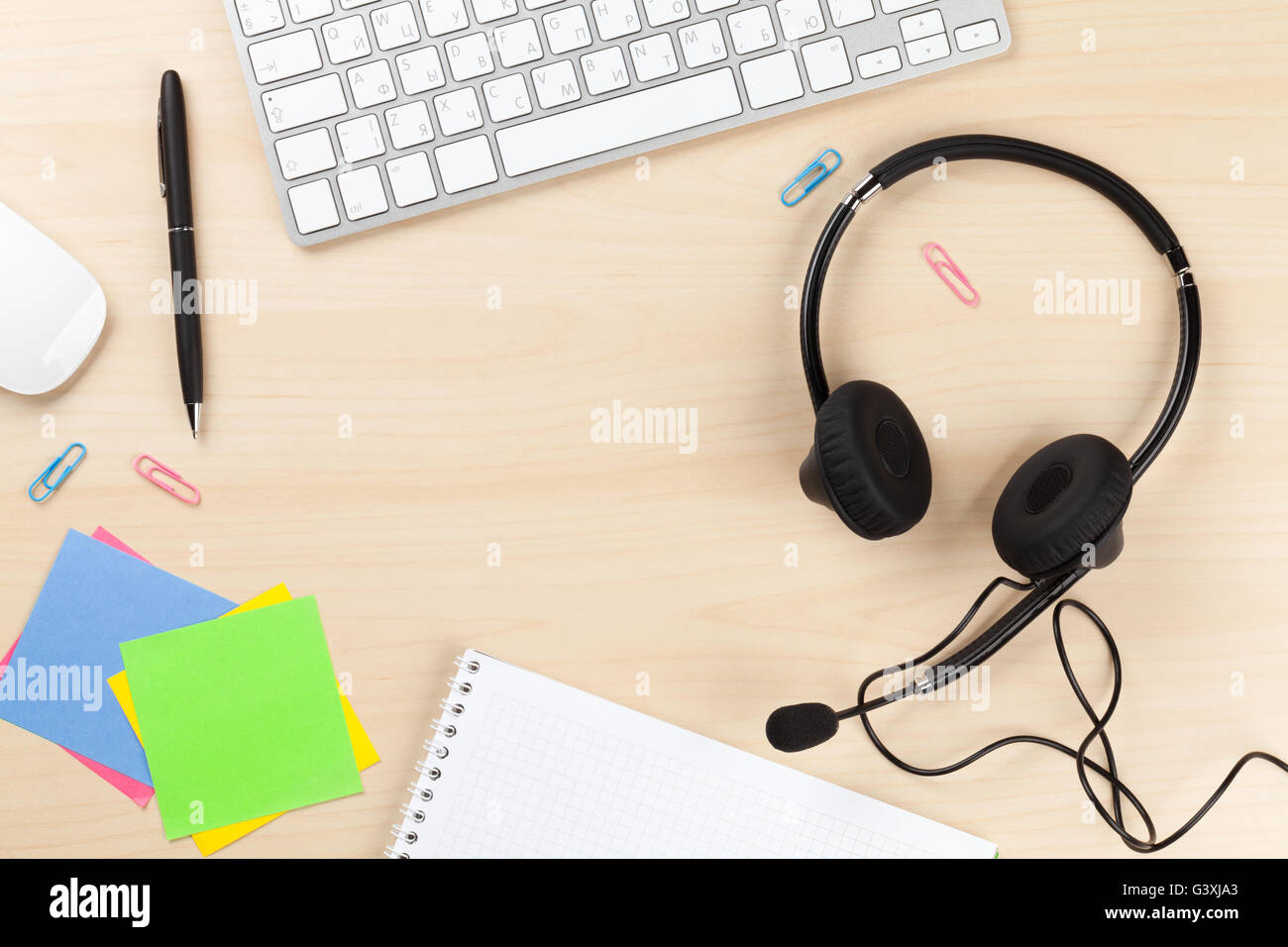 Office desk with headset and pc. Call center support table. Top veiw ...