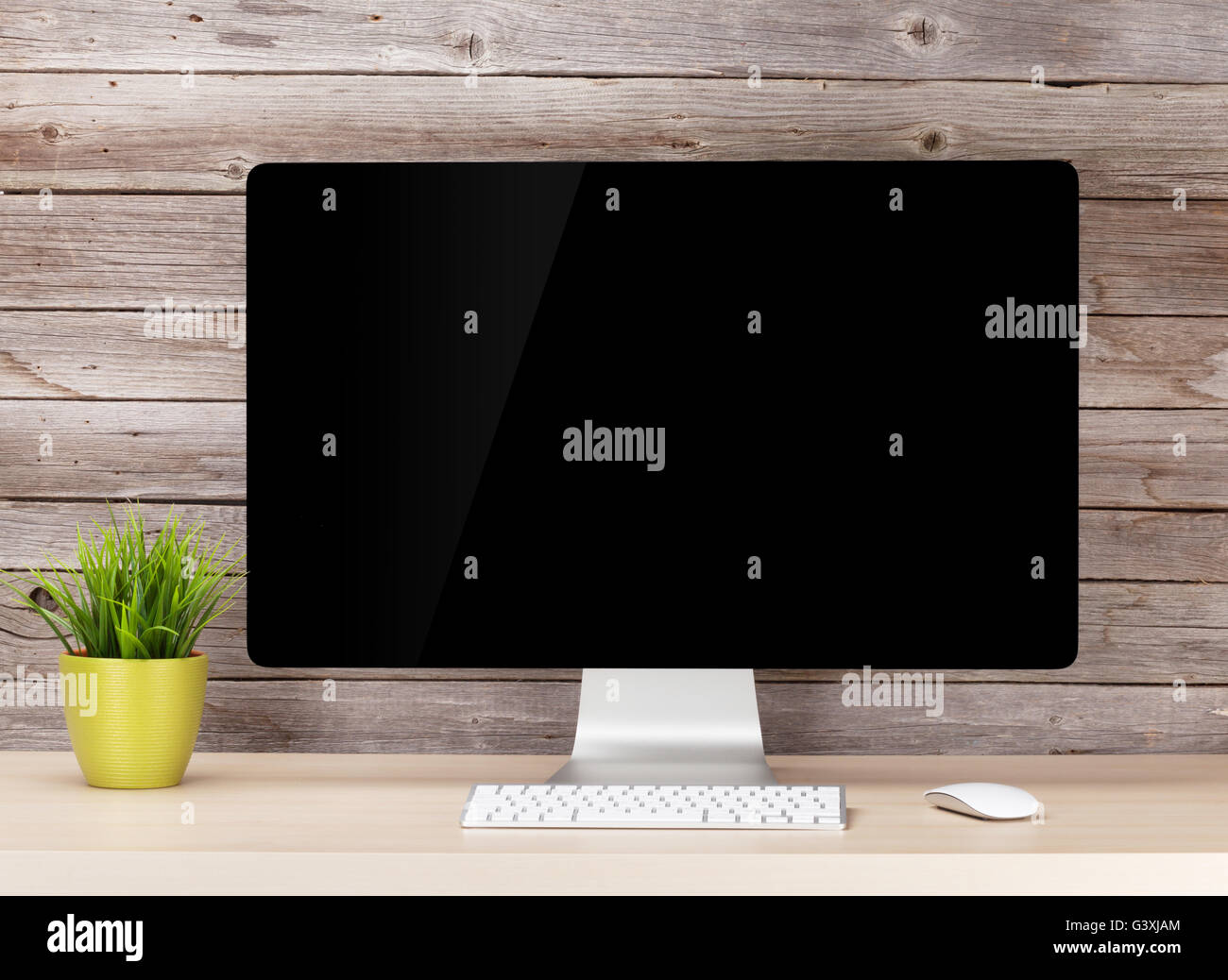 Office desk workplace with pc in front of wooden wall. Loft style Stock ...