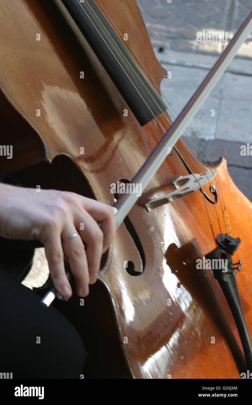 a detail of a musician playing the contrabass with fiddle Stock Photo ...