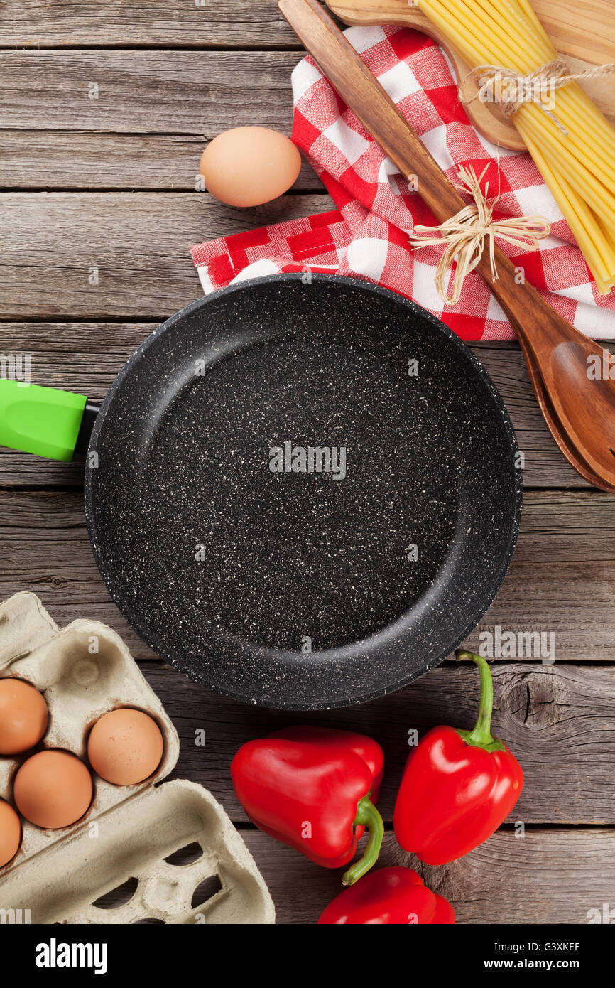 Cooking utensils and ingredients on wooden table. Top view with copy ...