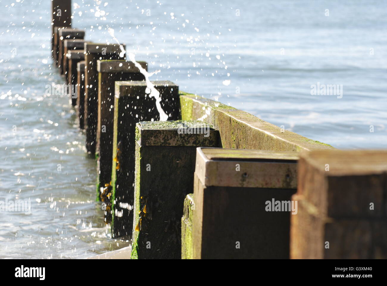 Water spray on wooden groyne at Bournemouth,Dorset,UK Stock Photo - Alamy