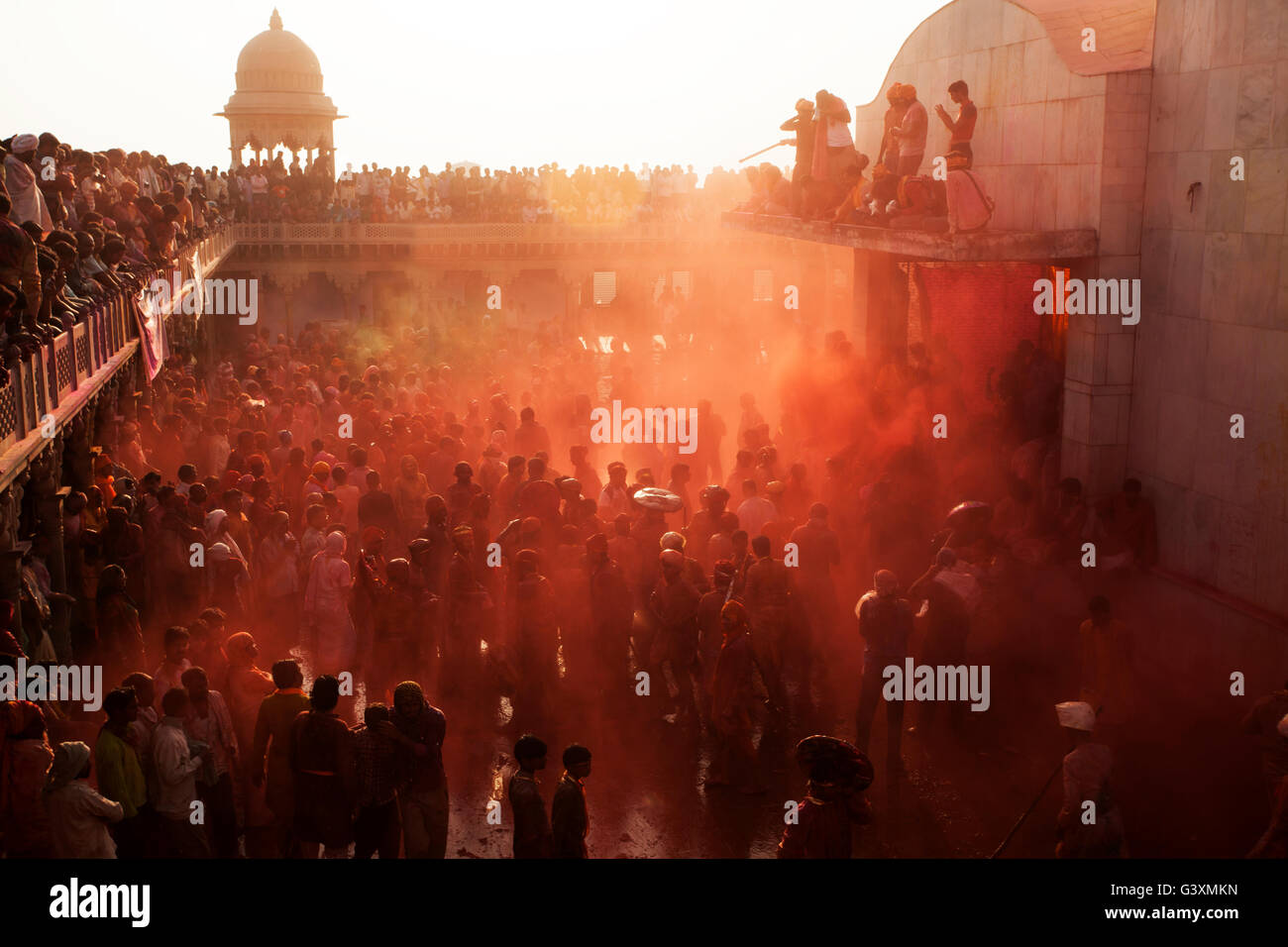 A large group of people playing Holi in Krishna Temple of Uttar Pradesh ...