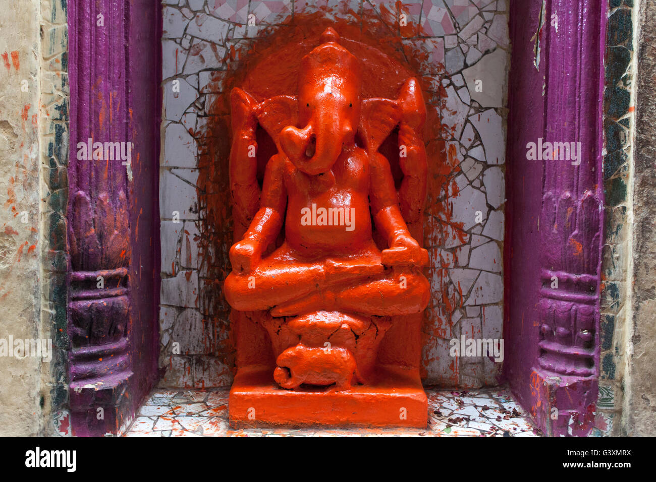Lord Ganesha painted with red color Stock Photo - Alamy