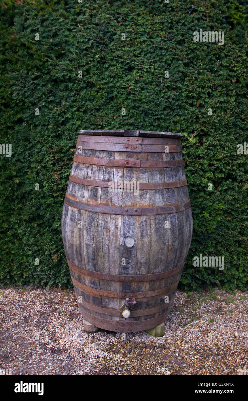 A heavy oak water butt at Igtham mote, Kent Stock Photo - Alamy