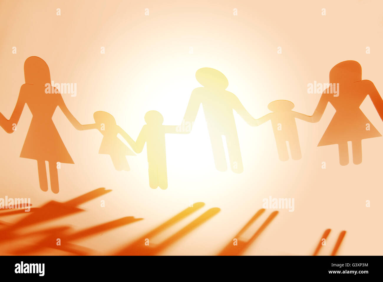 Family paper chain cutout holding hands Stock Photo - Alamy