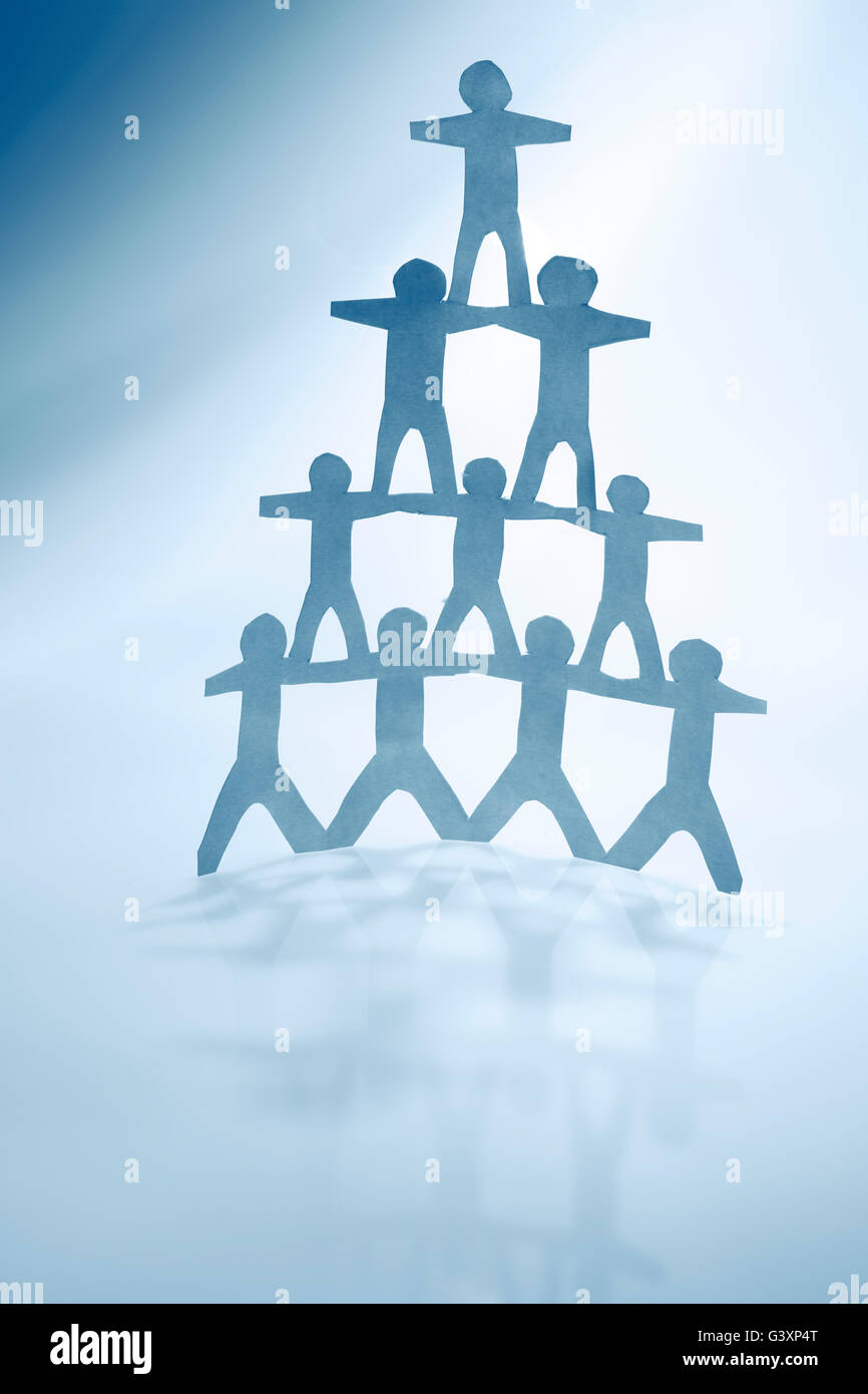Human team pyramid holding hands Stock Photo - Alamy